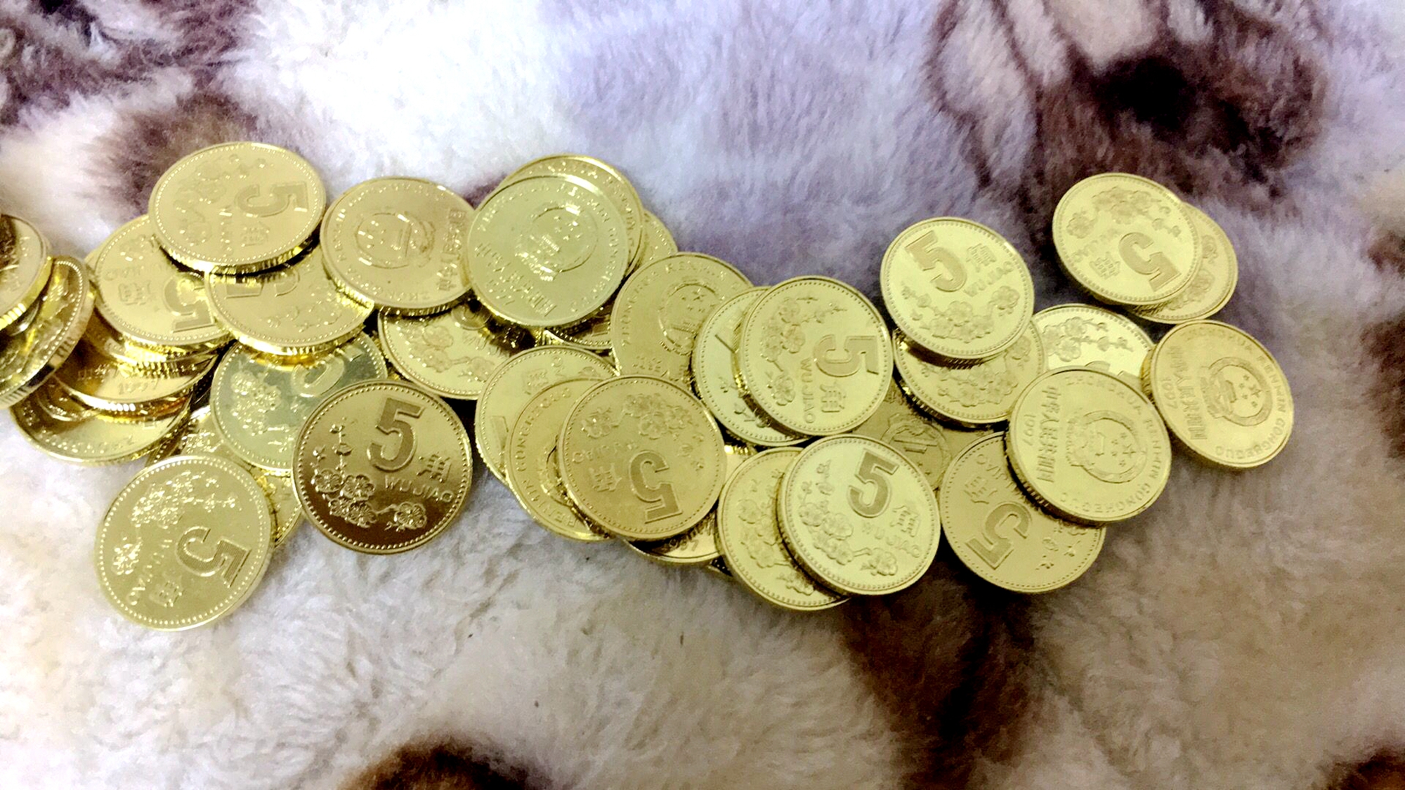 不再使用的5角硬币，有的价值4元，有的价值21元，你的是哪种？